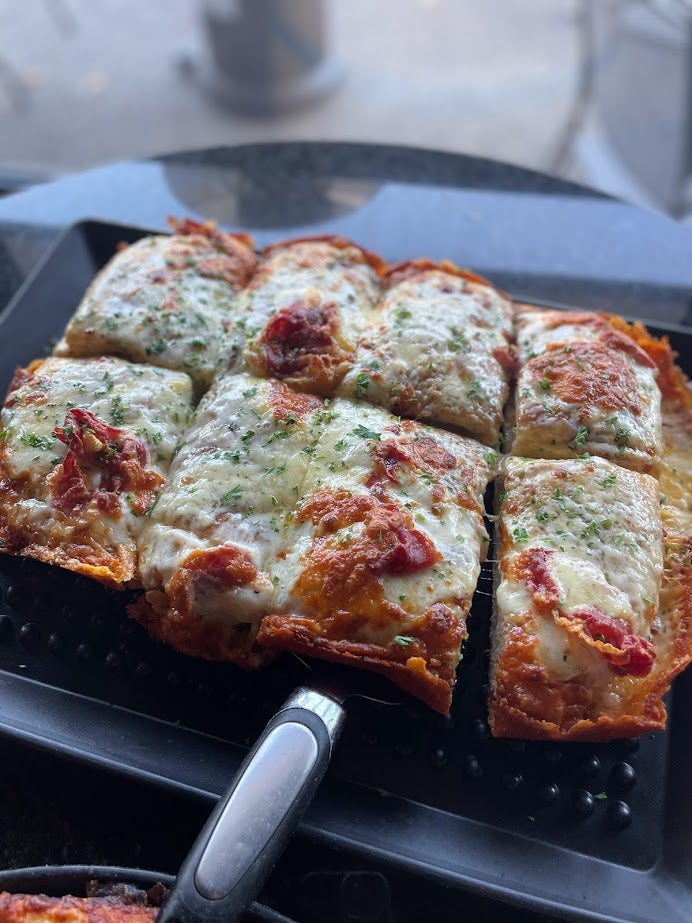 All over our large round pizzas are 16" and cut into 8 slices